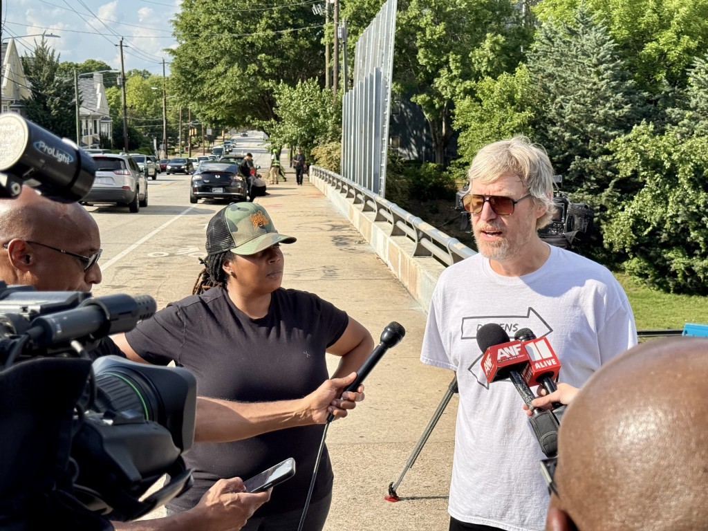 Cop City ribbon-cutting prompts block party and banner drop